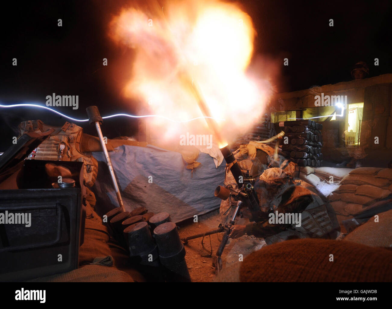 British Gurkha soldiers fire mortars from FOB Delhi, at Taliban ...