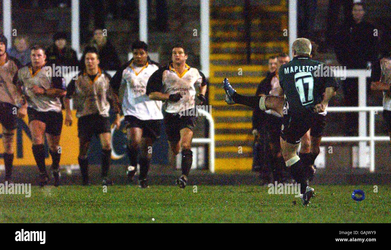 London Irish's Mark Mapletoft fires in the winning kick as he converts ...