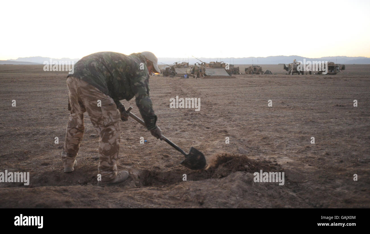 Prince Harry digs a trench to burn rubbish in at dawn in the desert in ...