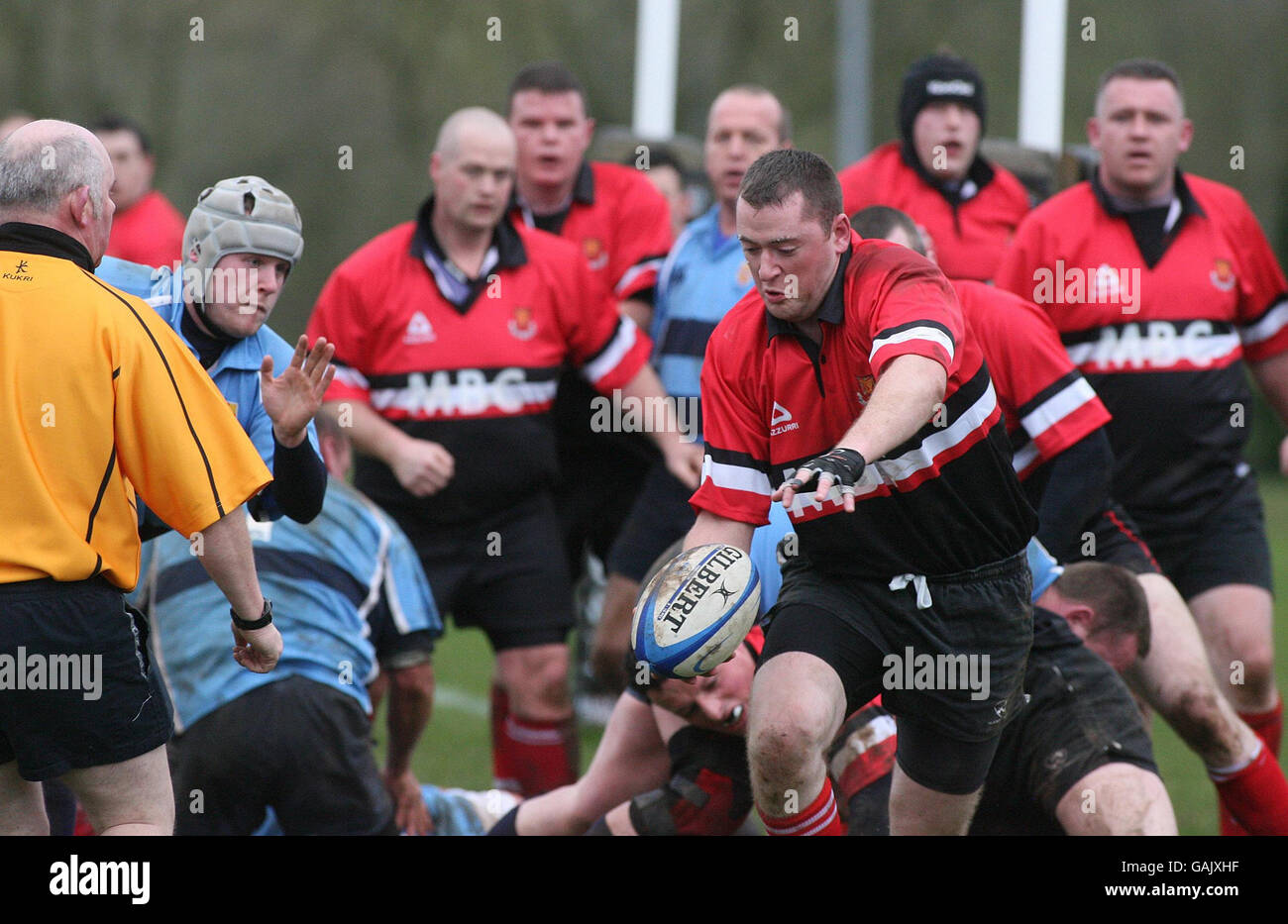 Prison Service rugby game. Irish Prison service (red) clear the ball ...