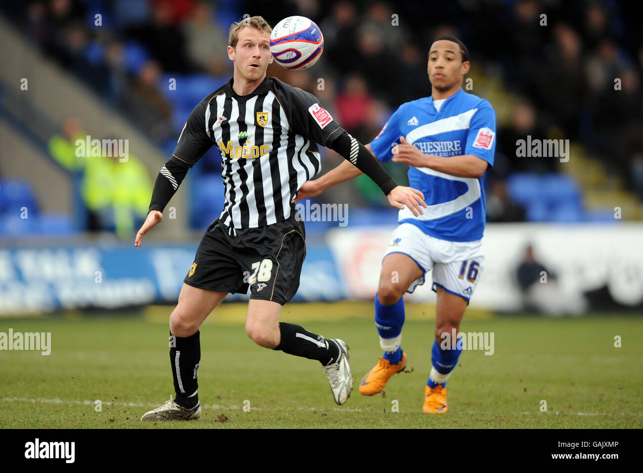 Notts County's Ryan Jarvis and Macclesfield Town's Izak Reid (r) battle ...