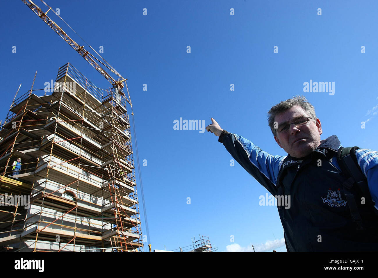 Paul Hansard in front of the 100 ft crane that he had earlier scaled in ...