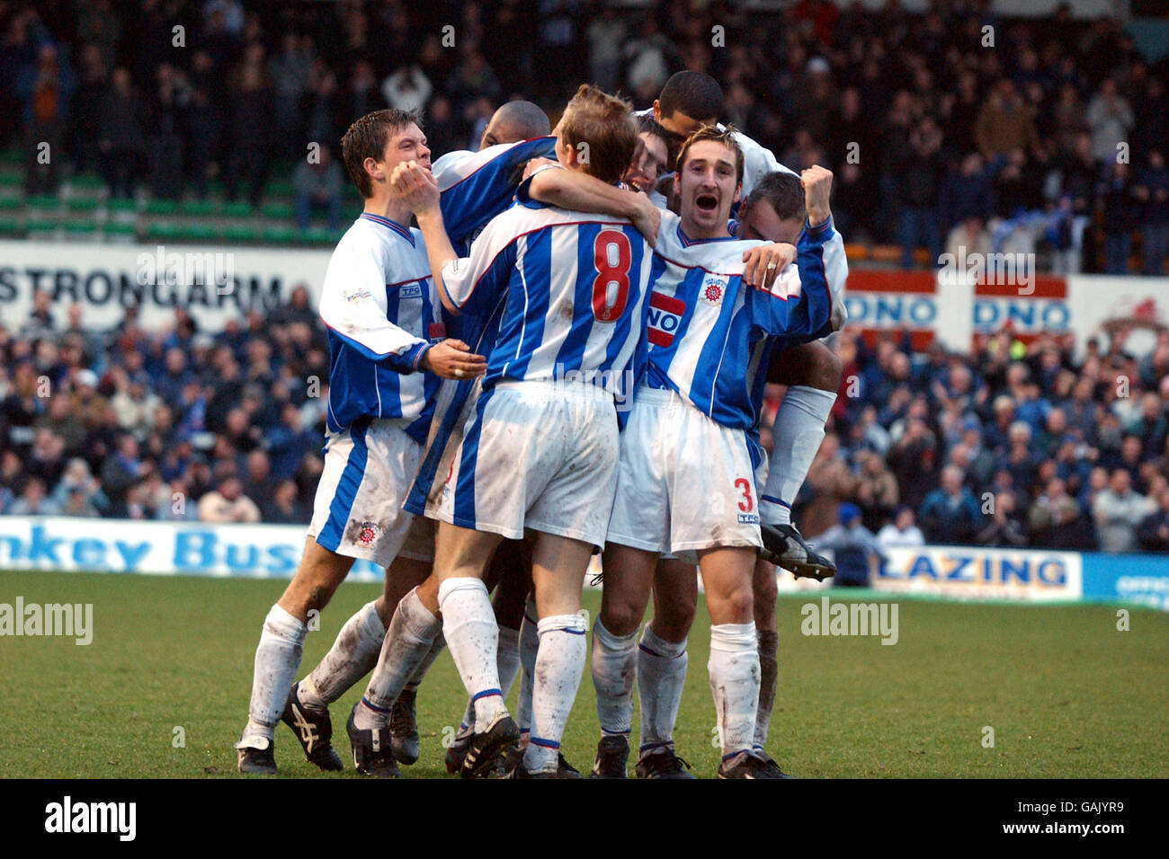 Hartlepool United's Graeme Lee (hidden) is congratulated on scoring ...