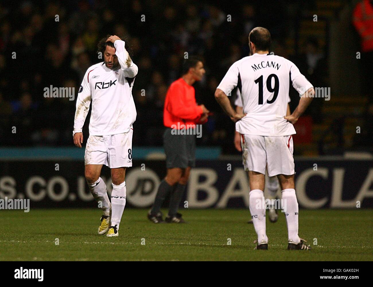 BOlton anderes Ivan Campo and Gavin McCann stand dejected after Simon ...