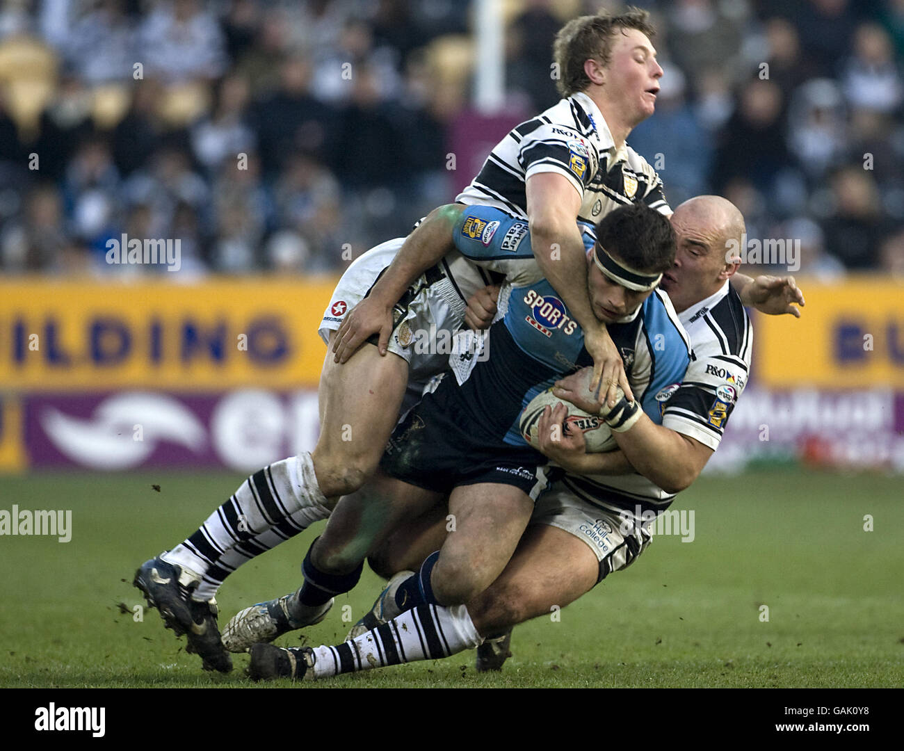 Harlequins' Chad Randall is brought down in a tackle by Hull FC's ...