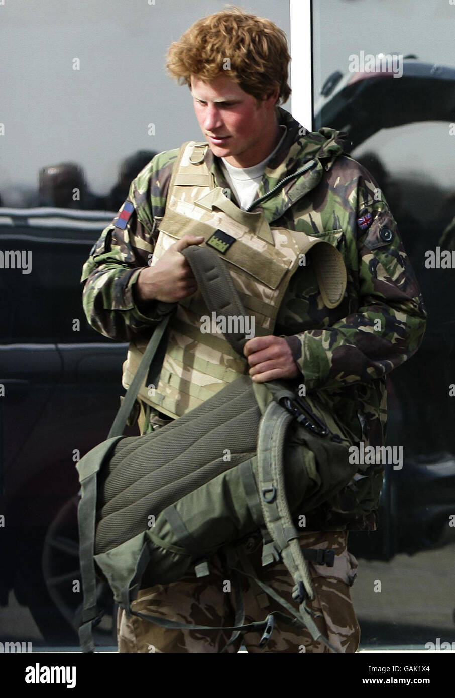 Prince Harry leaves the departures terminal at RAF Brize Norton in ...