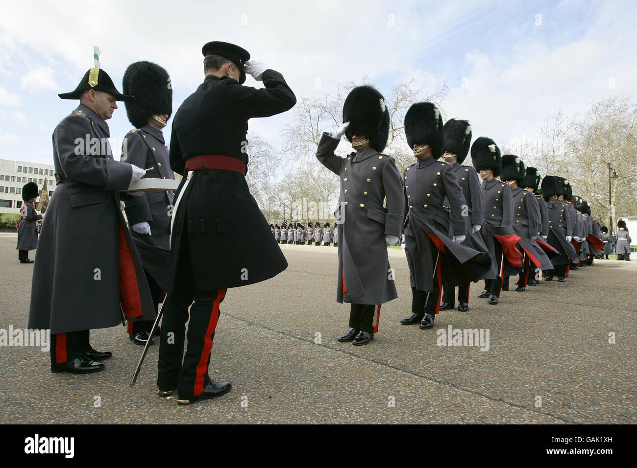 A company commander from the First Battalion Welsh Guards salutes ...