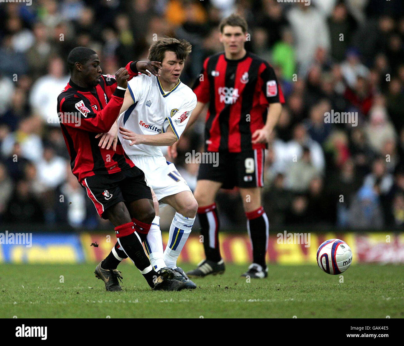 Leeds United's Jonathan Howson and Bournemouth's Jo Kuffour battle for ...