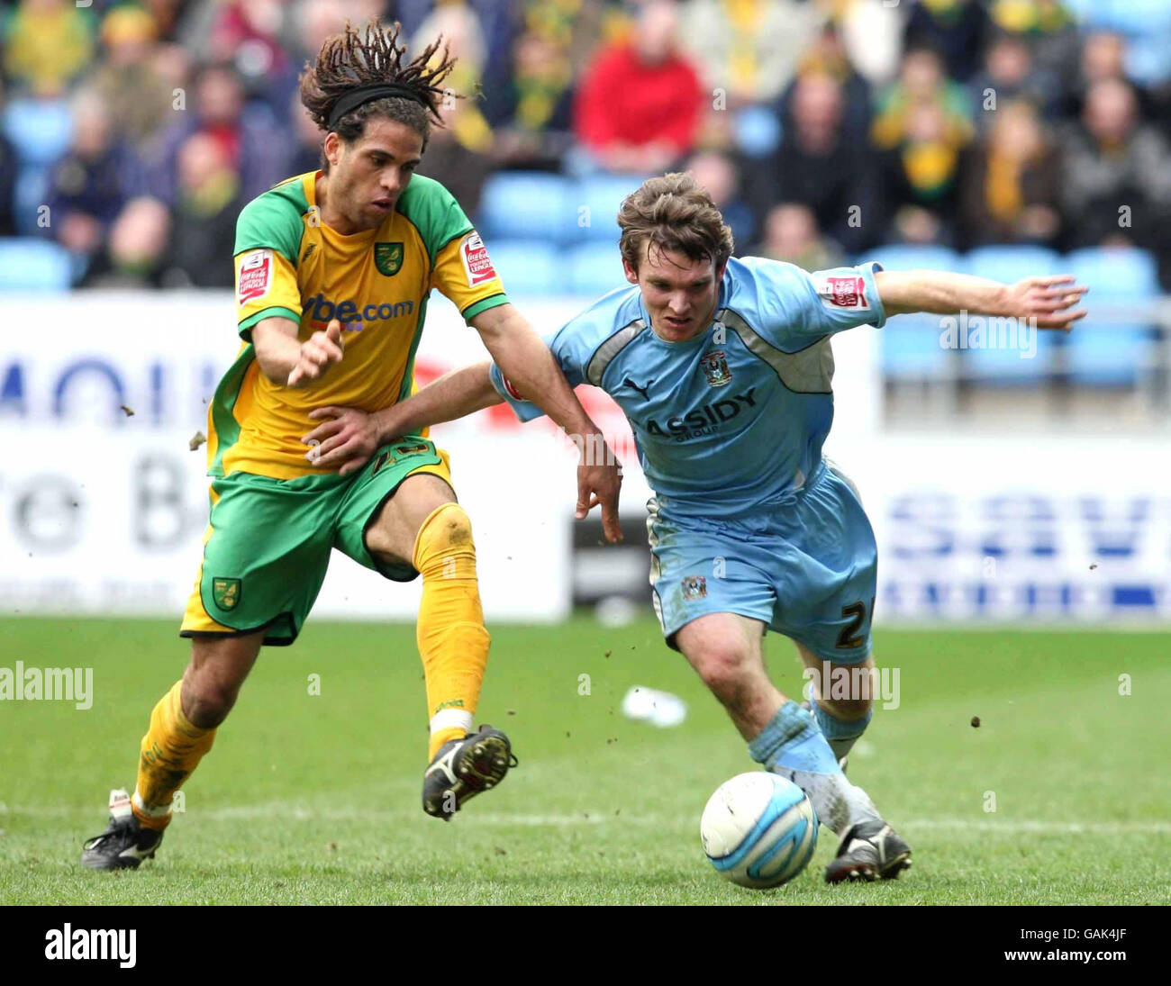 Coventry's Jay Tabb and Norwich City's Darel Russell compete for the ...
