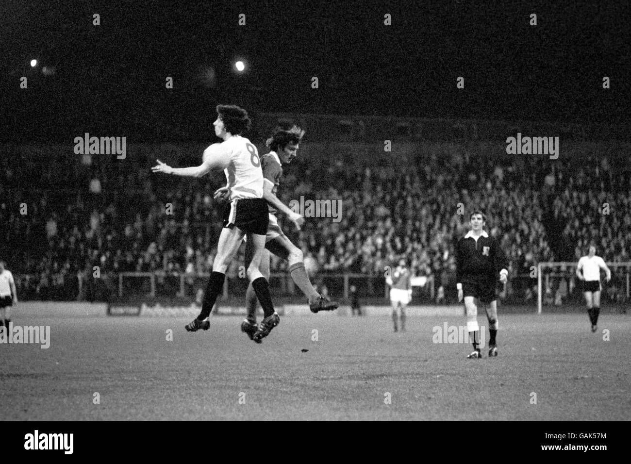 Tom Ritchie (No. 8) of Bristol City in a duel for the ball with a ...