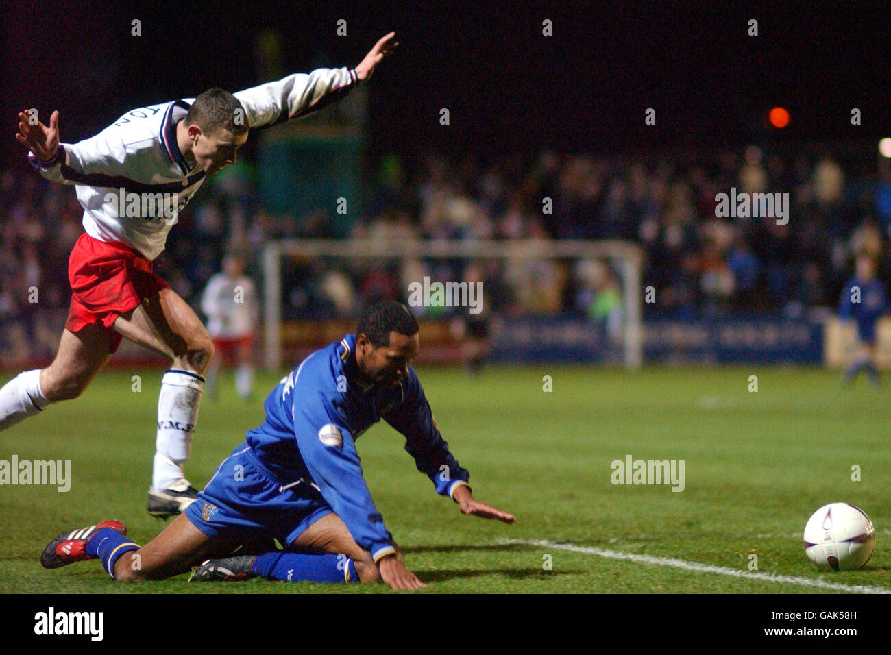 Macclesfield Town's Kyle Lightbourne (r) and Vauxhall Motors' Robbie ...