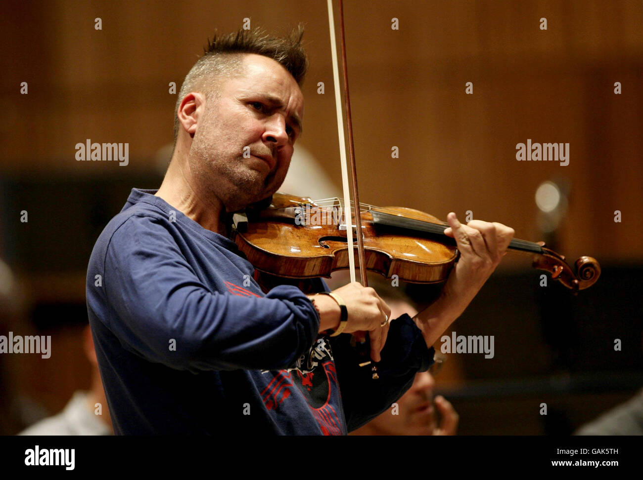 Nigel Kennedy performing with the Royal Philharmonic Orchestra, during ...
