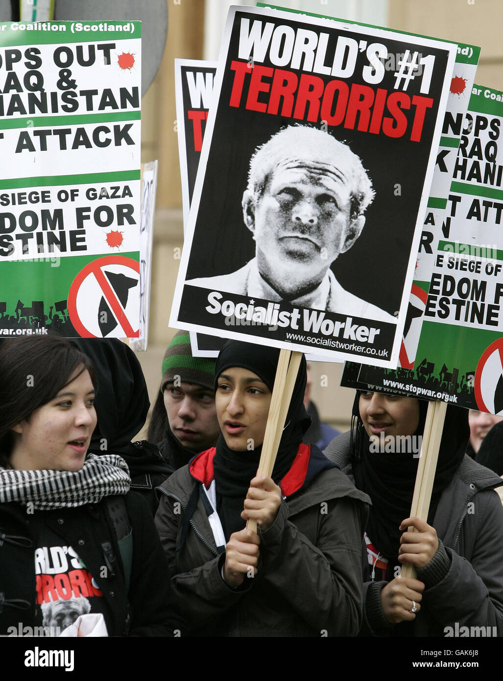Anti-war protestors hold placards during a anti-war protest in Glasgow ...