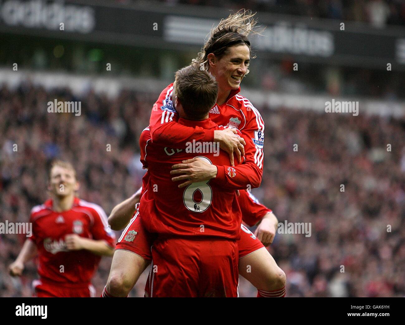 Liverpool's Fernando Torres (right) celebrates scoring the third goal ...