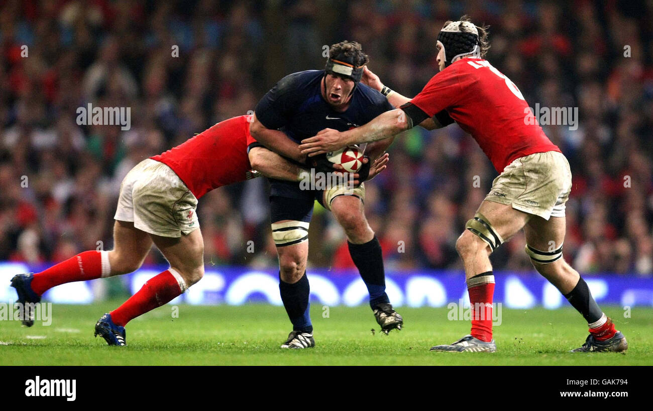 Wales's Tom Shanklin and Ryan Jones tackle France's Jerome Thion during ...
