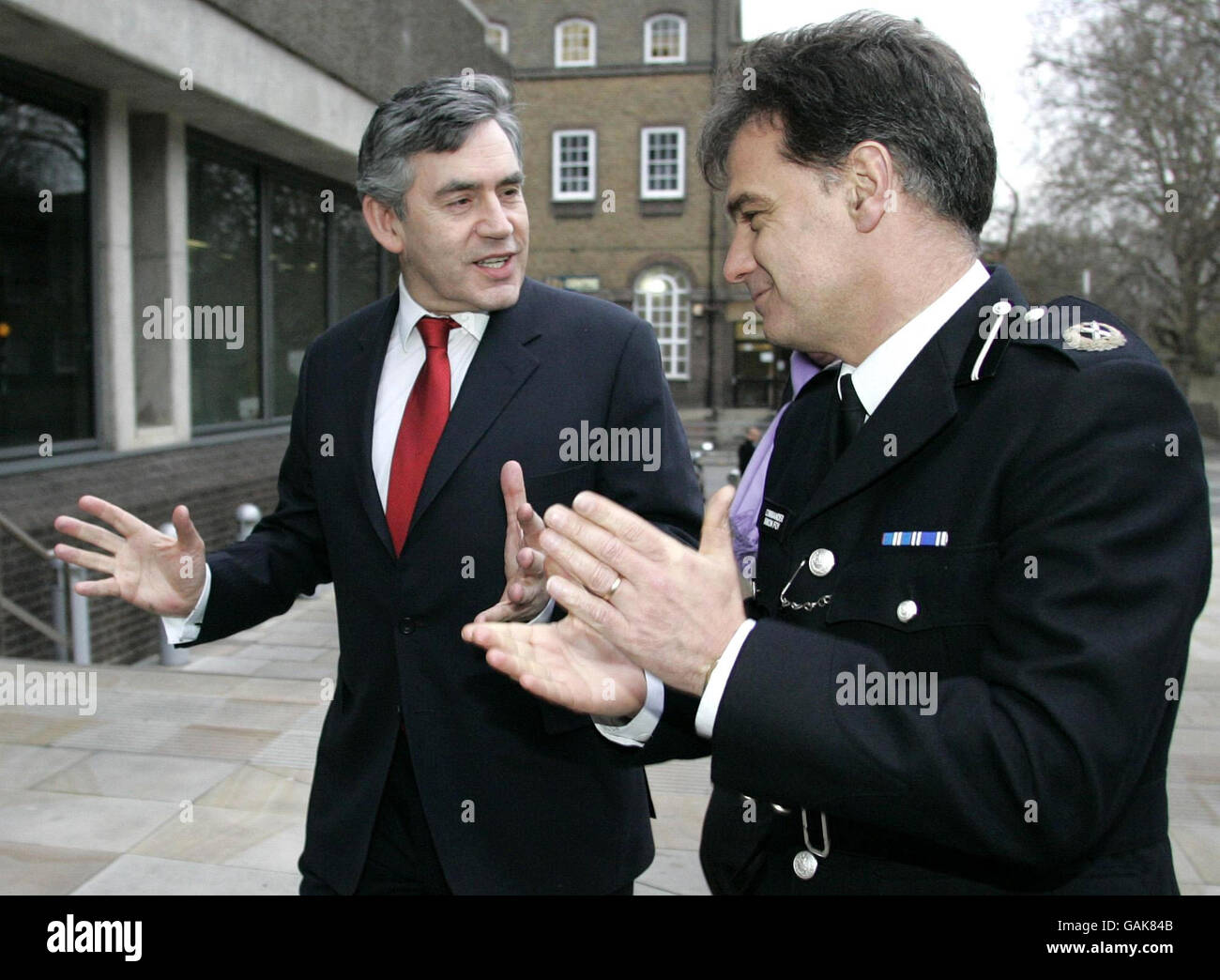 Prime Minister Gordon Brown talks with Commander Simon Foy as he ...