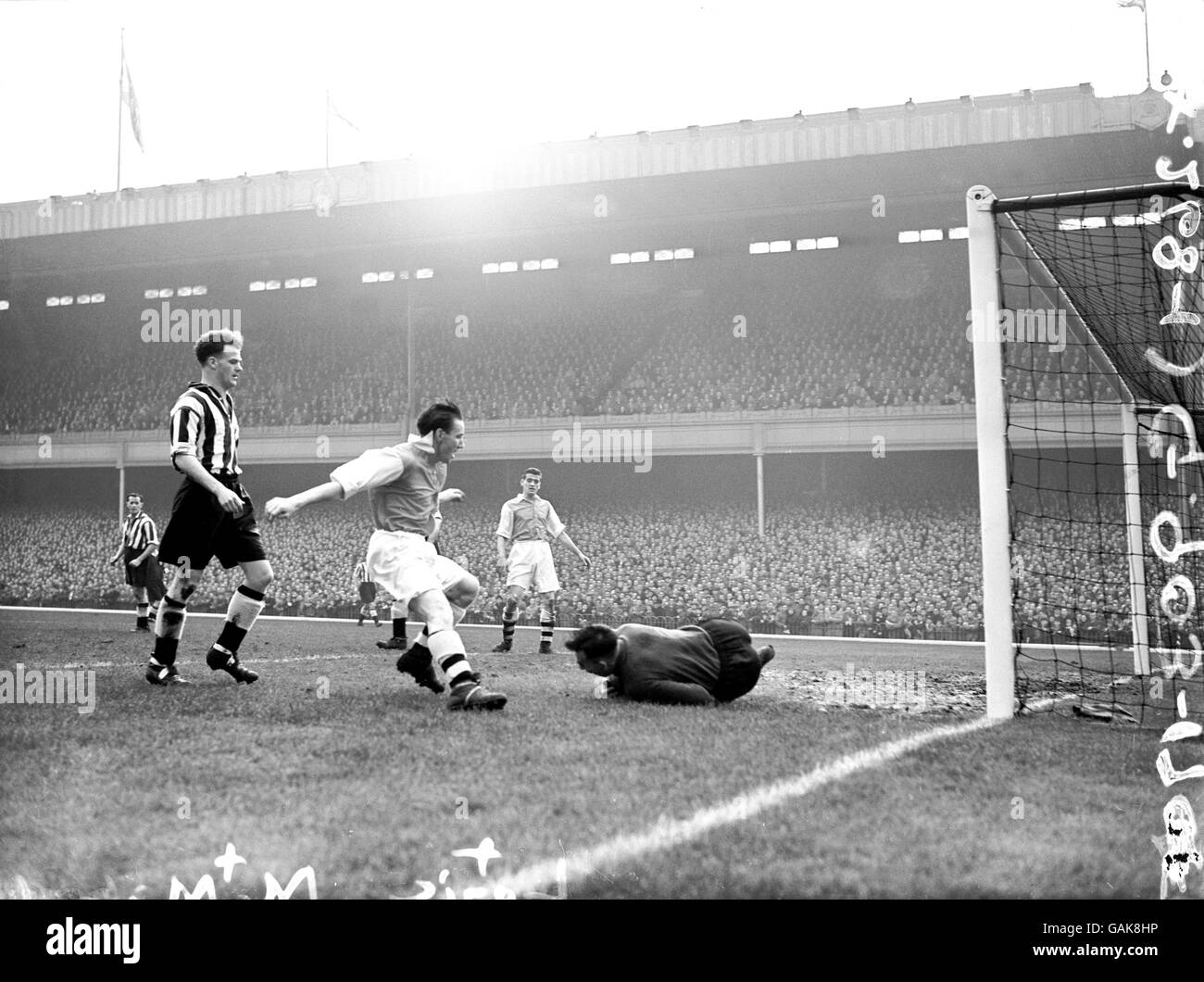 Newcastle United goalkeeper Bob Robinson (r) gathers the ball at the ...