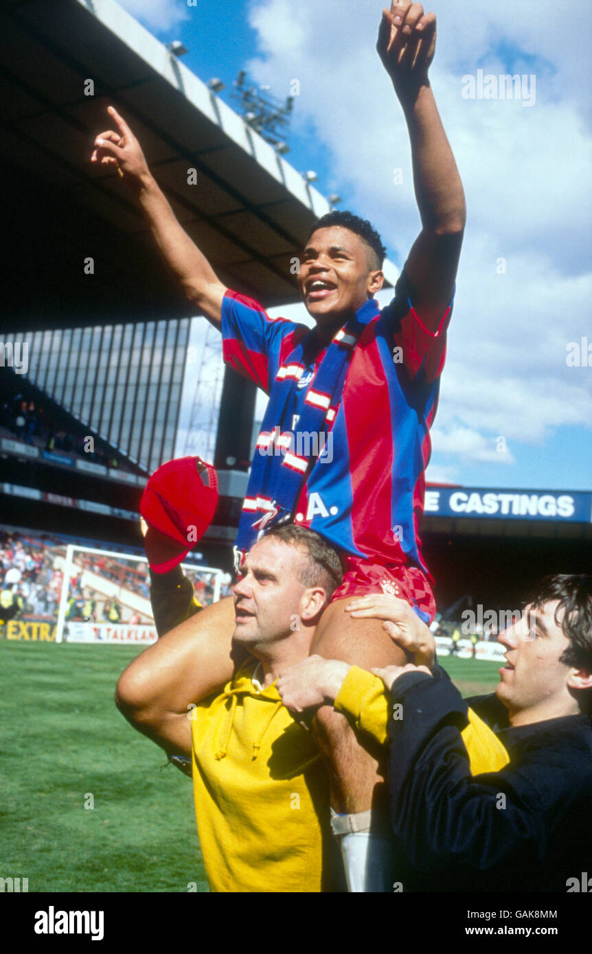 A Crystal Palace fan carries John Salako on his shoulders after Palace ...