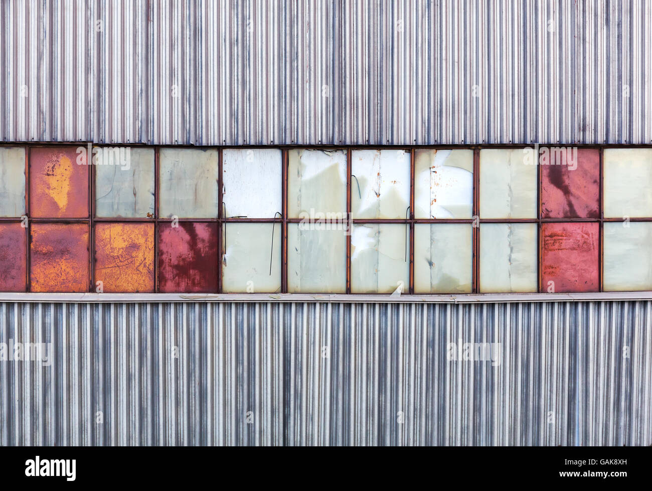 Old broken window in gray corrugated metal wall Stock Photo - Alamy