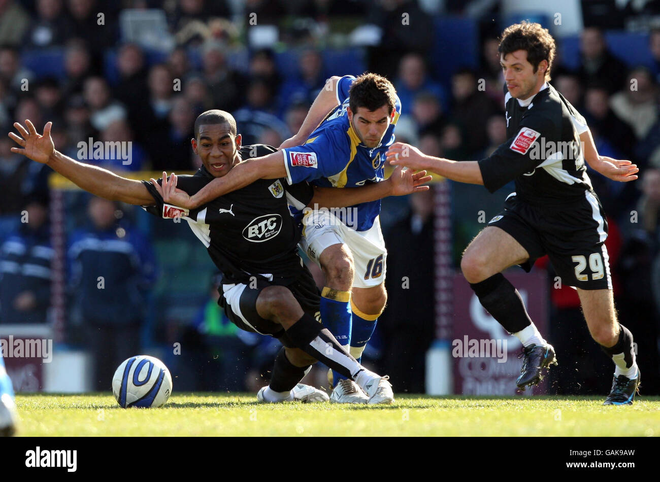 Cardiff City's Joe Ledley competes with Bristol's Marvin Elliott (left ...