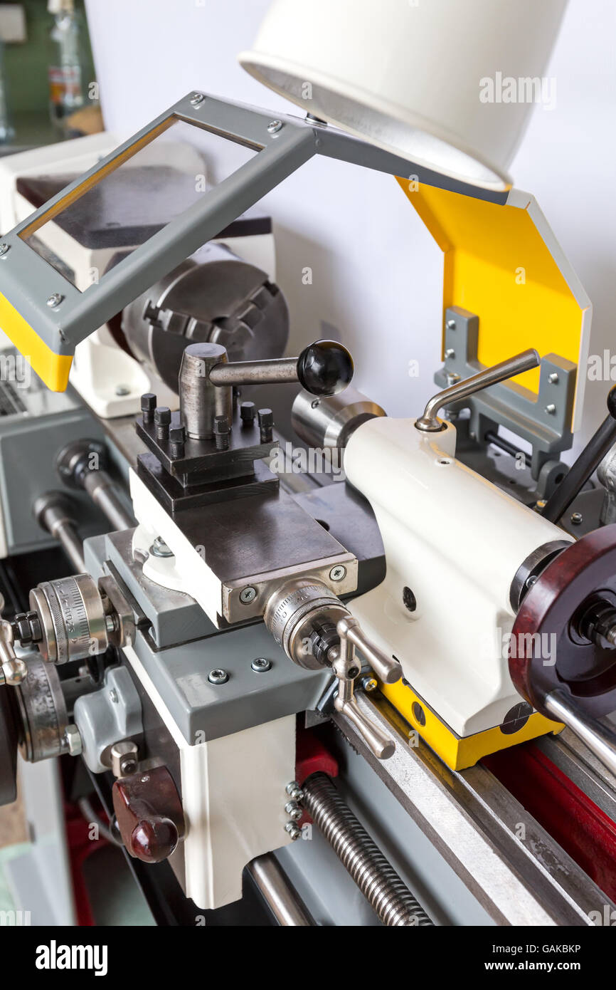 Metal lathe machinery tool equipment in workshop Stock Photo - Alamy
