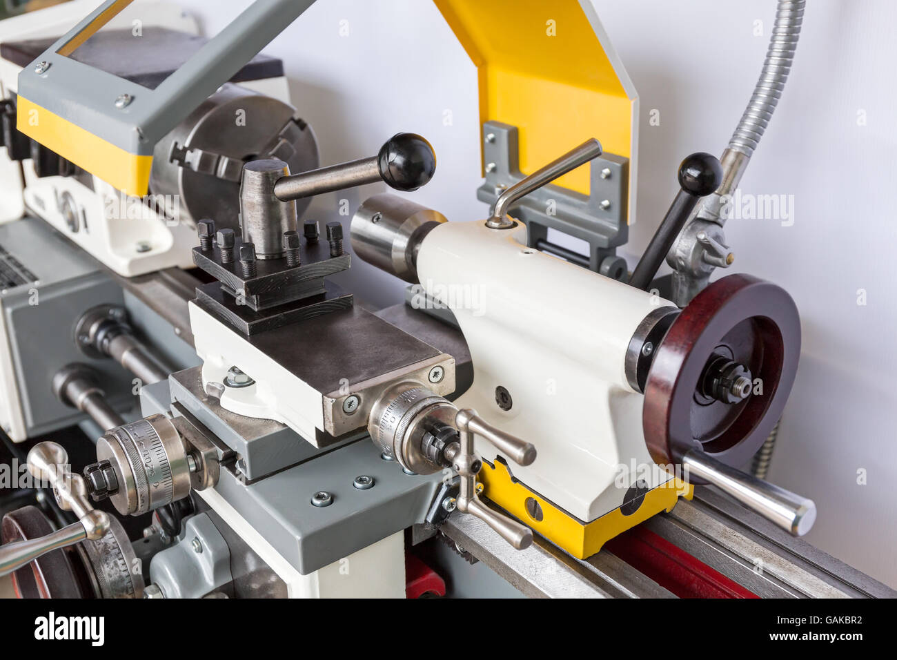 Metal lathe machinery tool equipment in workshop Stock Photo - Alamy