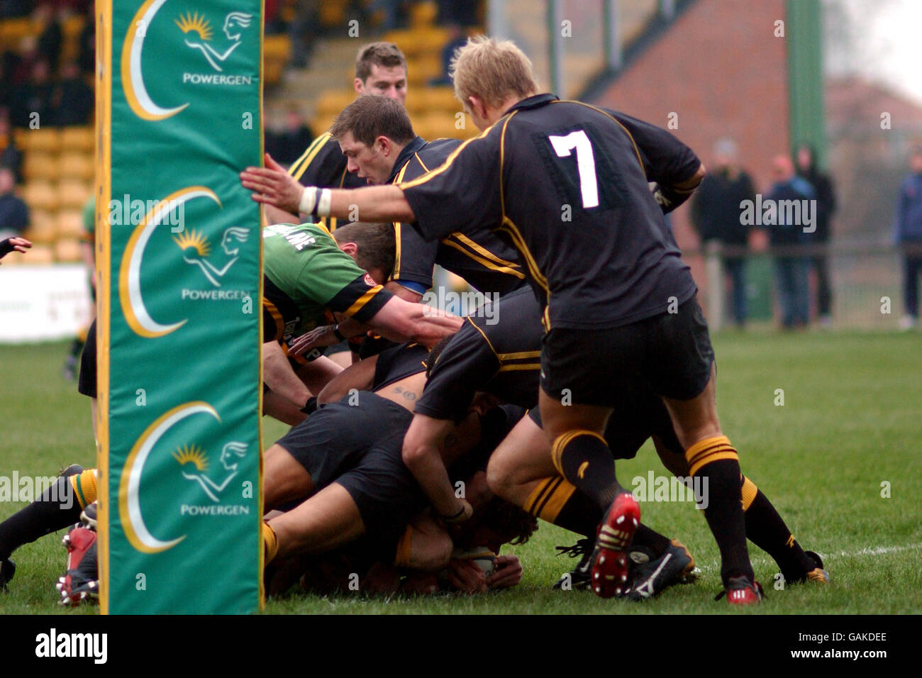 Northampton Saints' Peter Jorgensen (centre on floor) goes over for a ...