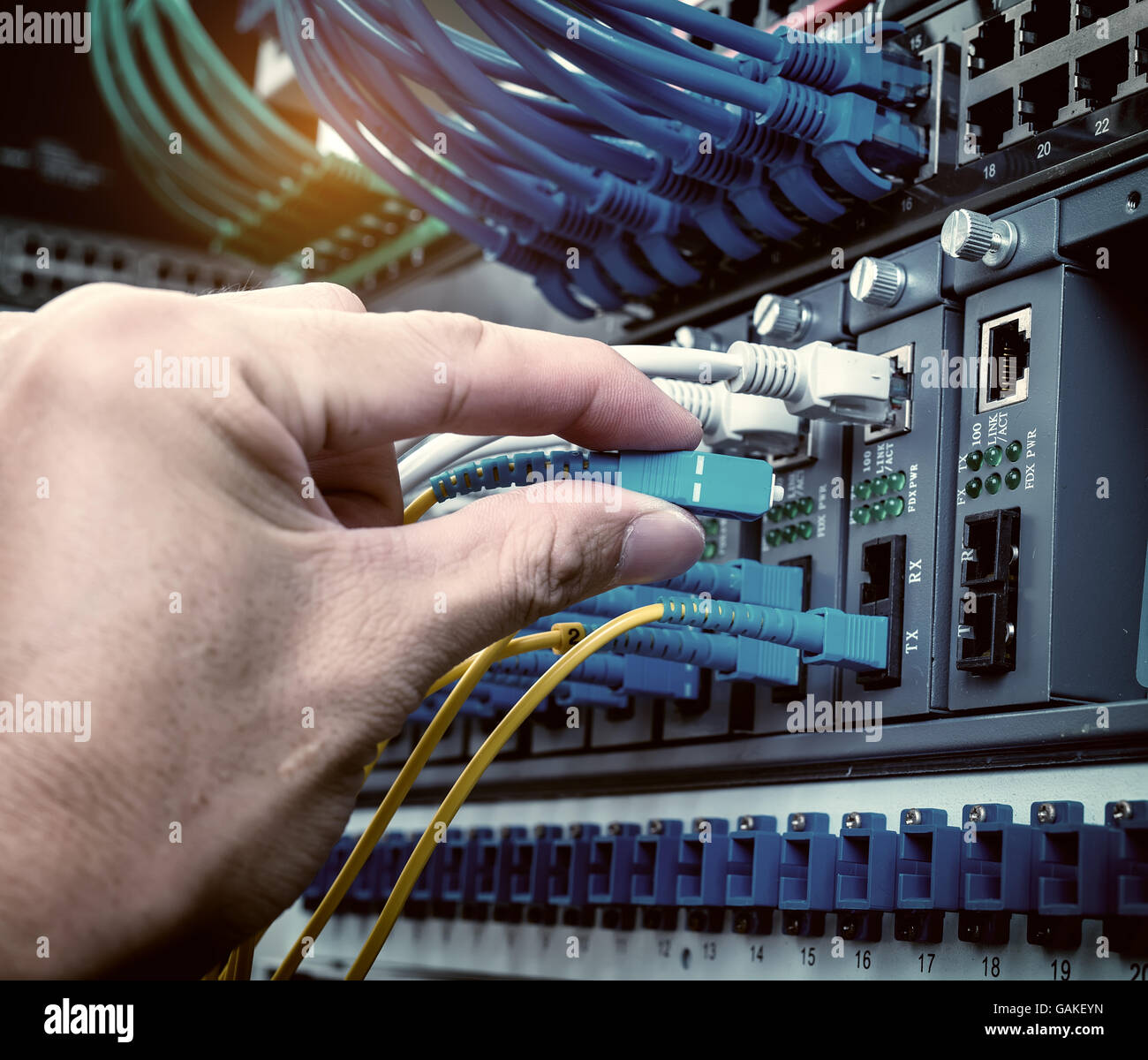 Engineer connecting network cable switch hi-res stock photography and ...