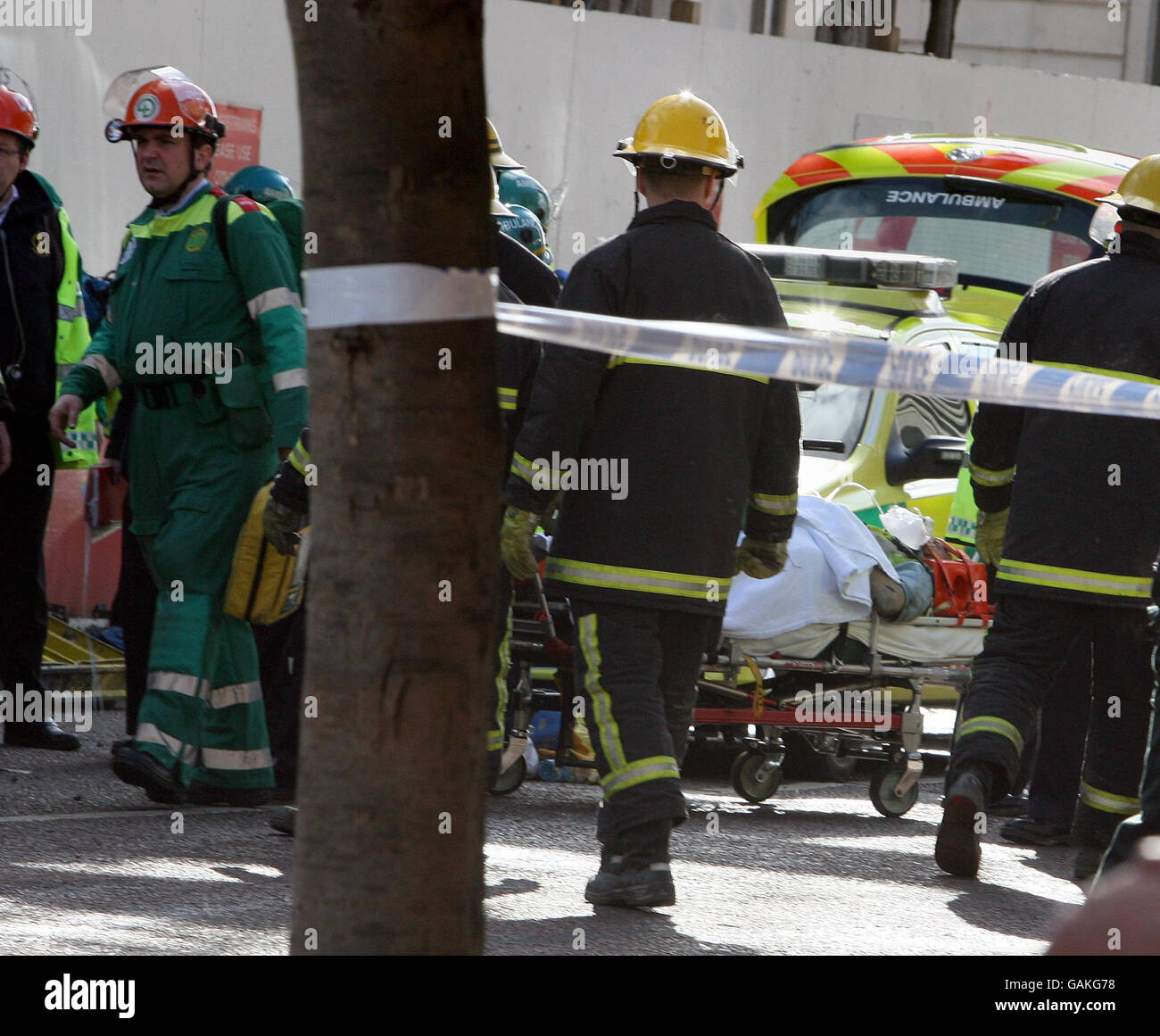 The emergency services remove a worker from the scene after a number of ...