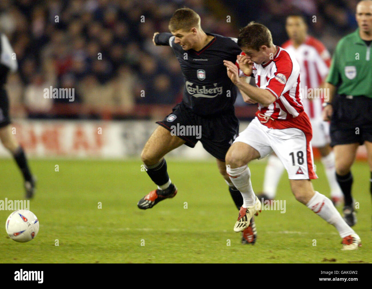 Michael tonge as they battle for the ball hi-res stock photography and ...