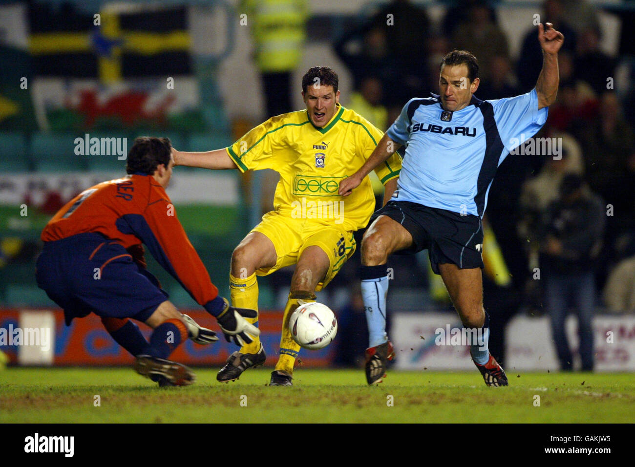 (R-L) Coventry City's Dean Holdsworth gets to the ball ahead of Cardiff ...