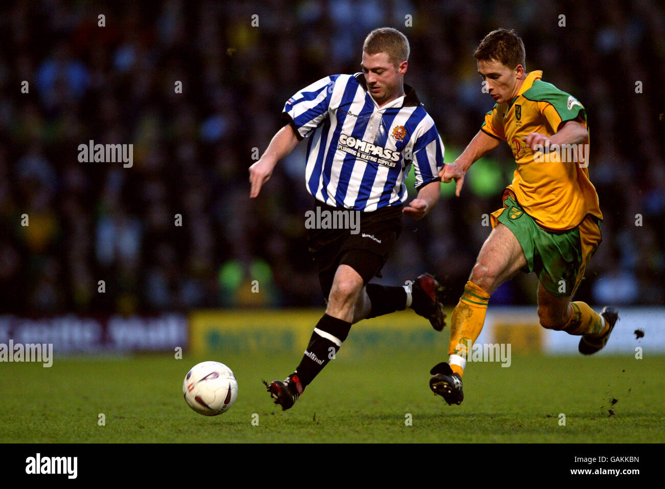 Norwich City's Adam Drury and Dagenham & Redbridge's Mark Janney Stock ...