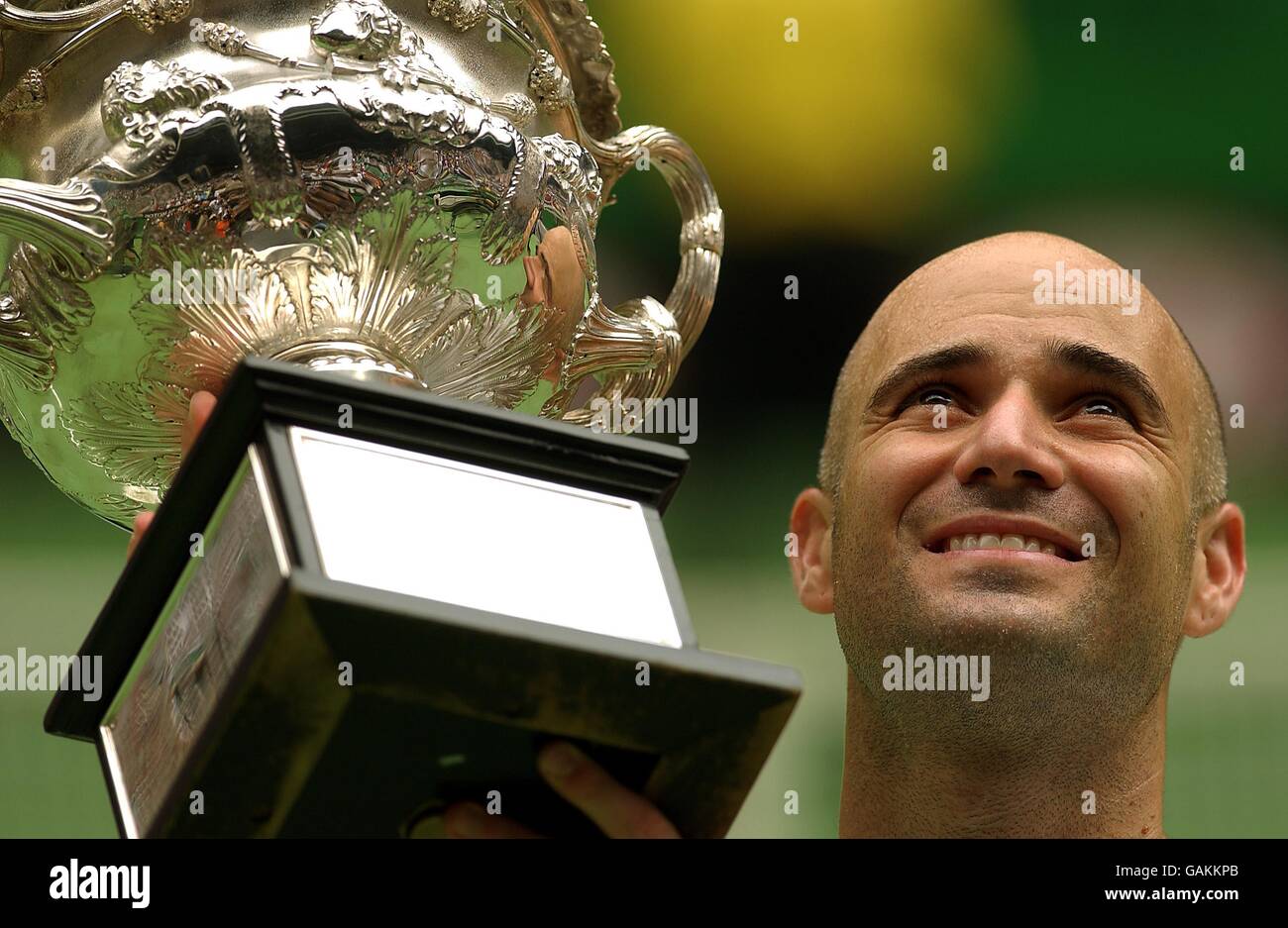 Andre agassi holds his australian open trophy hi-res stock photography ...