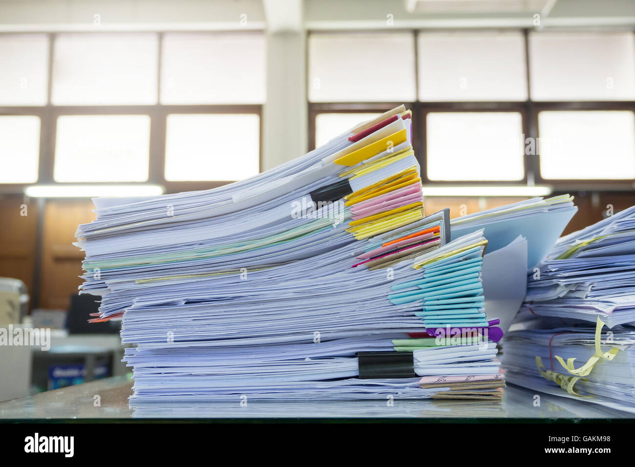 Messy office desk, Pile of unfinished paperworks Stock Photo - Alamy