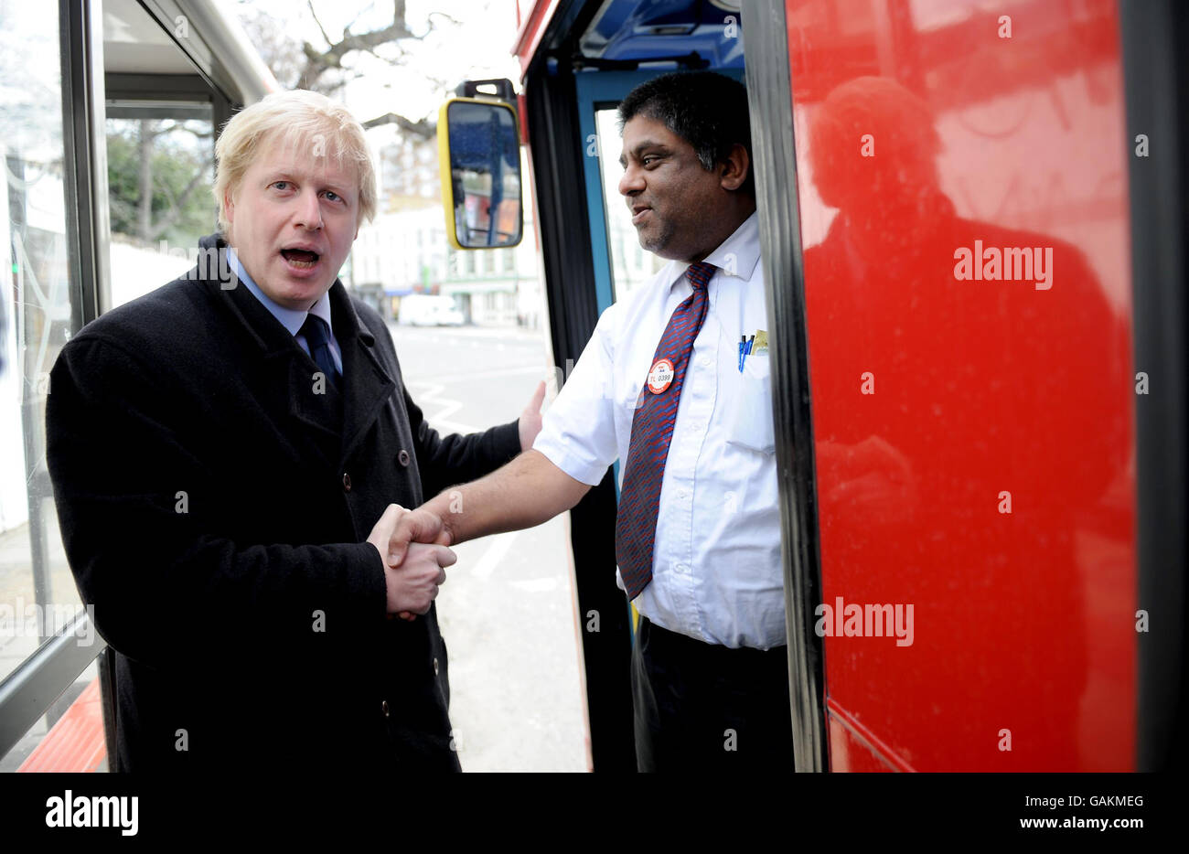 Conservative mayoral candidate Boris Johnson (left) meets a bus driver ...