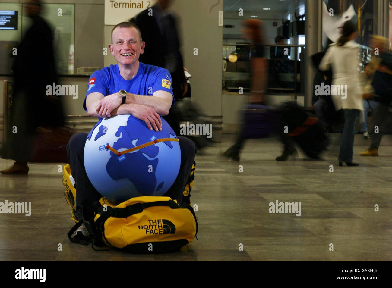 Blind runner Dave Heeley pictured at Heathrow Airport before flying to ...