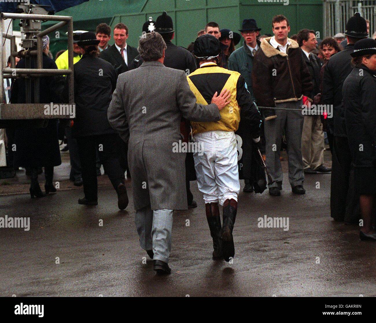 Jockey Martin Foster returns to the enclosure without his mount 'Paco's ...