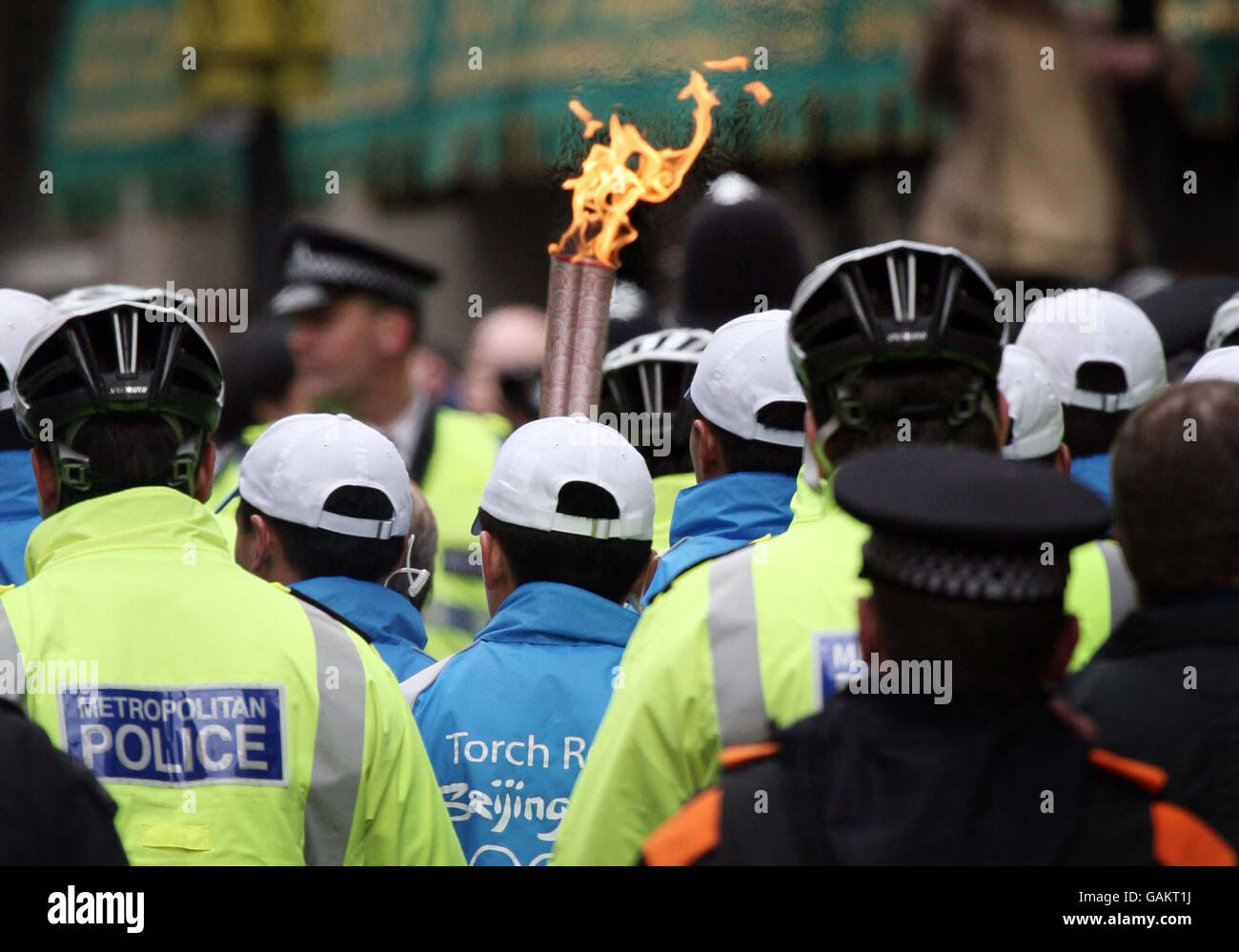 The Olympic torch passes through London's Chinatown during part of its ...