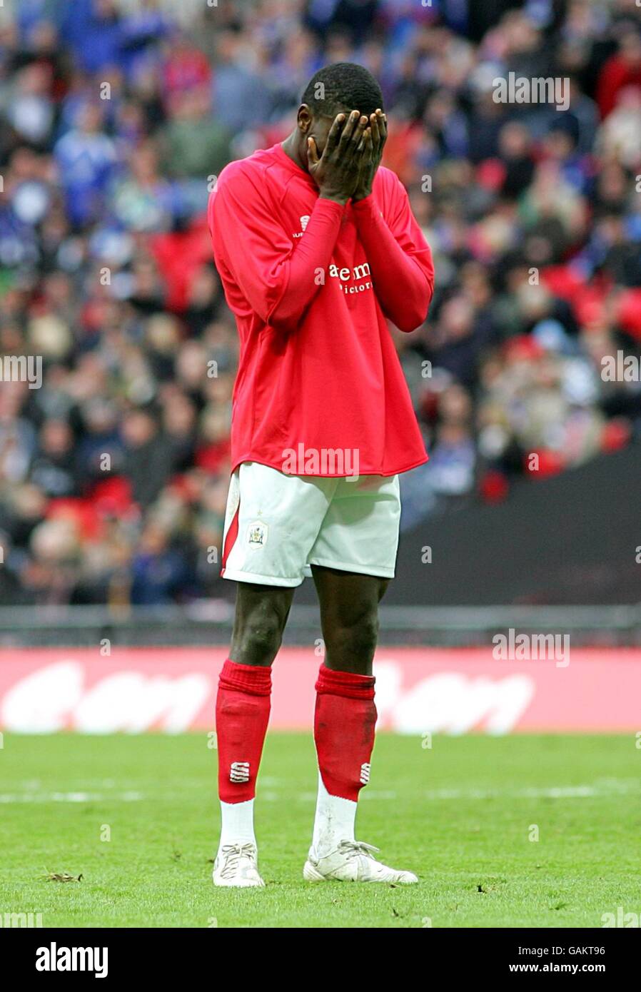 Barnsley's Kayode Odejayi stands dejected after missing a goalscoring ...