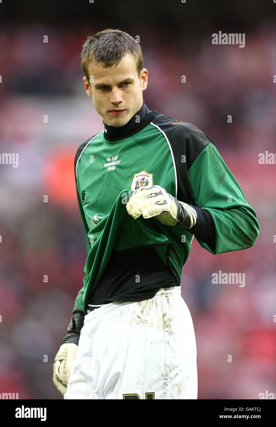 Barnsley goalkeeper luke steele stands dejected after the final whistle ...