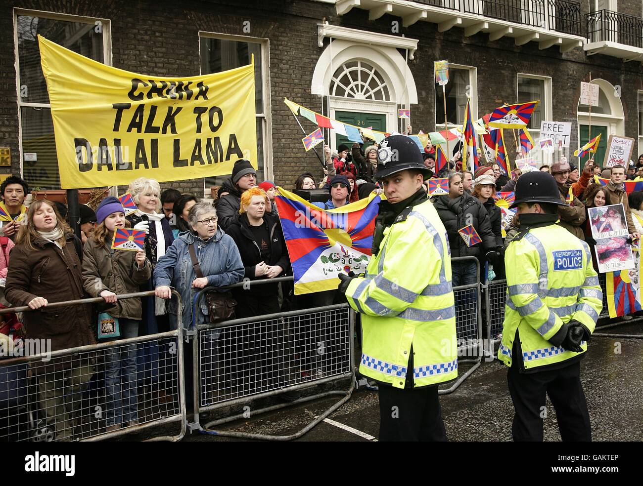Protesters demonstrate as the torch approaches Bridge Street during the ...