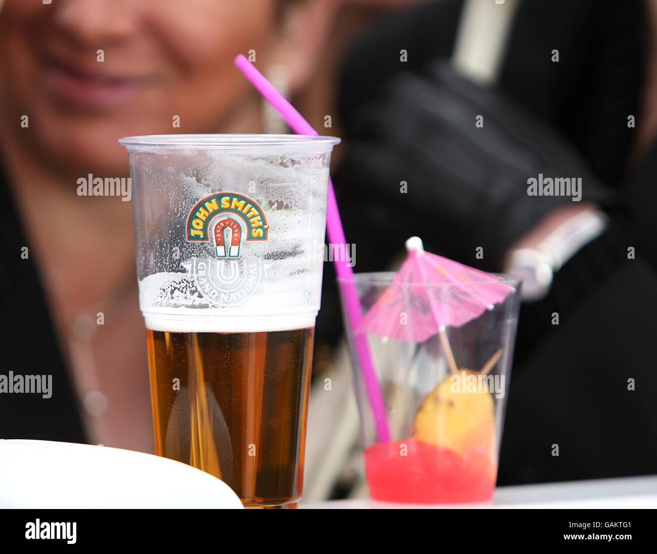 General view of a half full pint of john Smith's ale and a half drunk ...