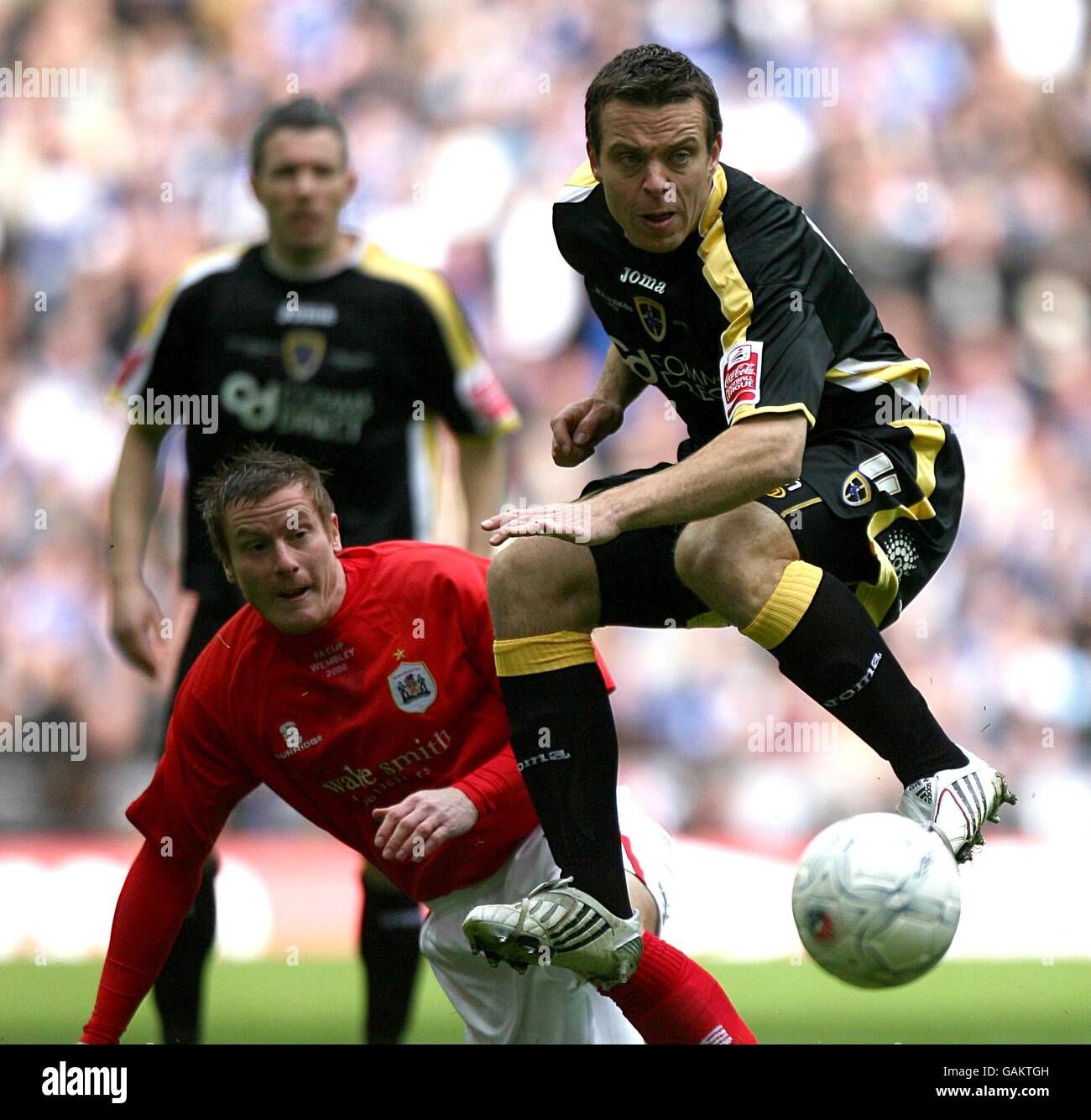 Cardiff City's Gavin Rae (r) and Barnsley's Bobby Hassell (l) battle ...