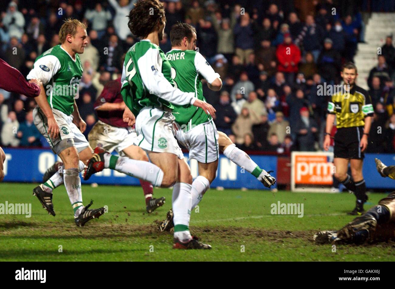 Hibernian's Grant Brebner (c) scores their fourth goal of the game from ...