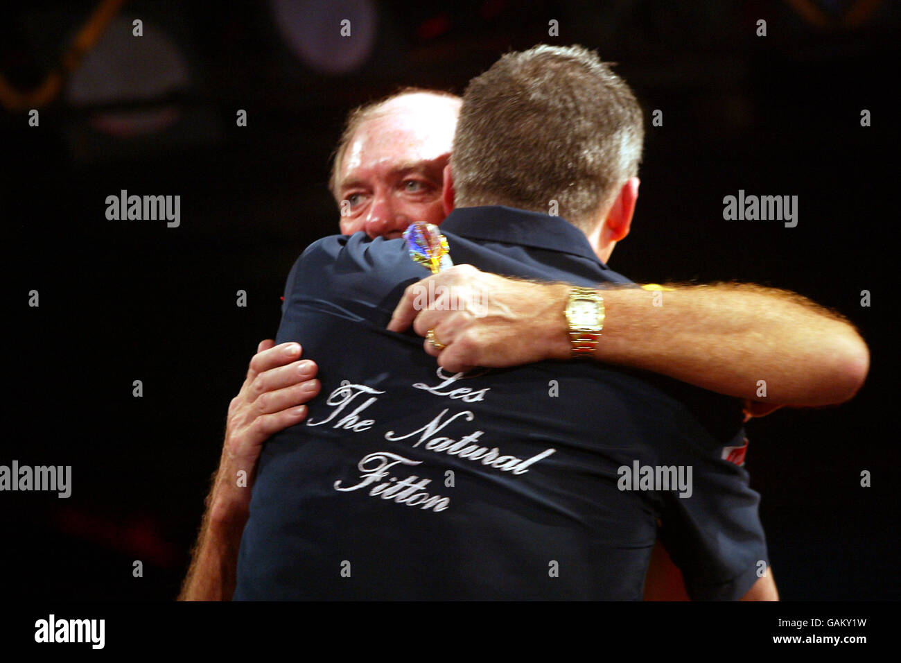 John Lowe (back) congratulates Les Fitton (front) after losing by four ...