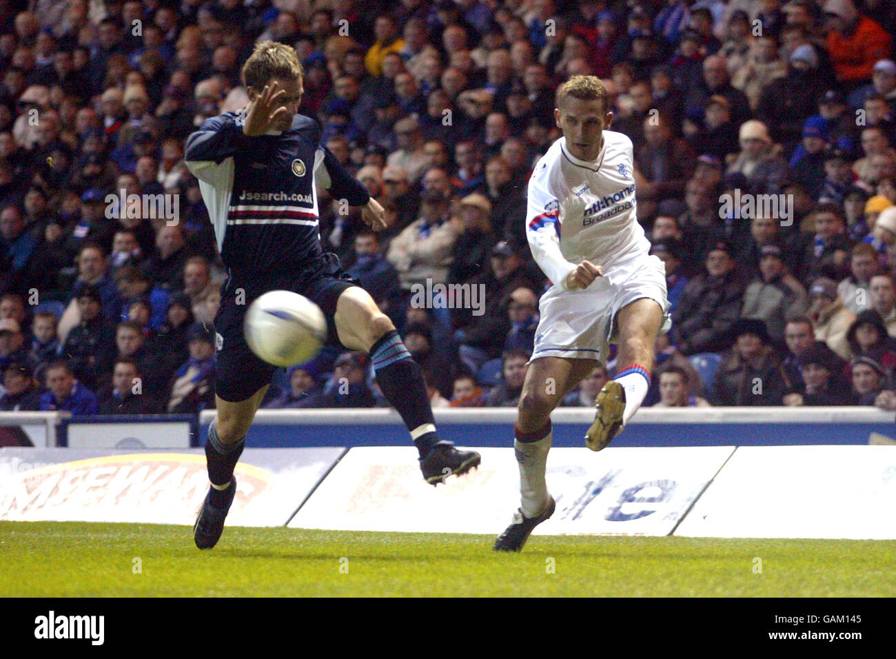 Rangers' Peter Lovenkrands (r) and Dundee's Steve Lovell (l) battle for ...