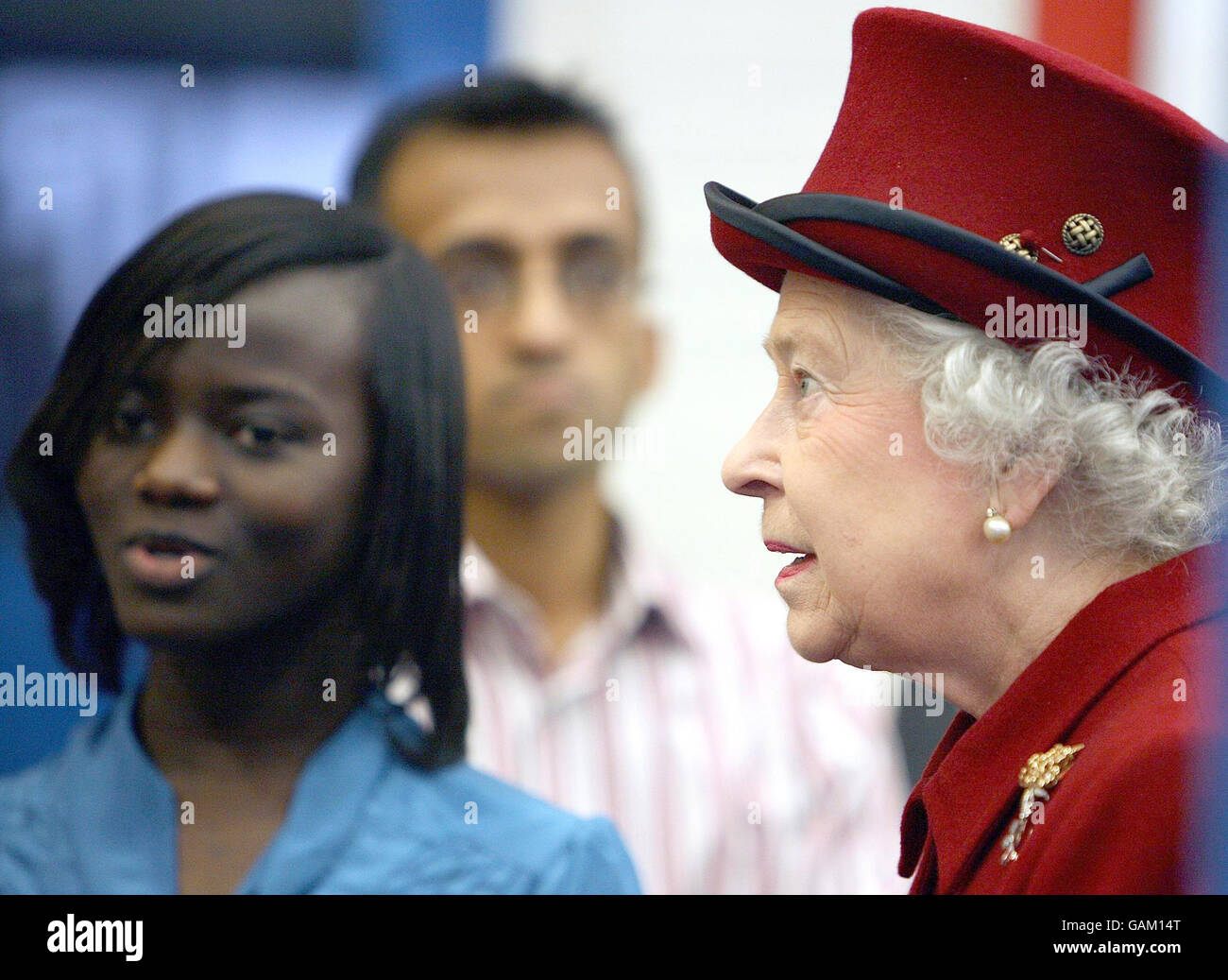 Queen Elizabeth II looking at items displayed on a Ebay computer screen ...