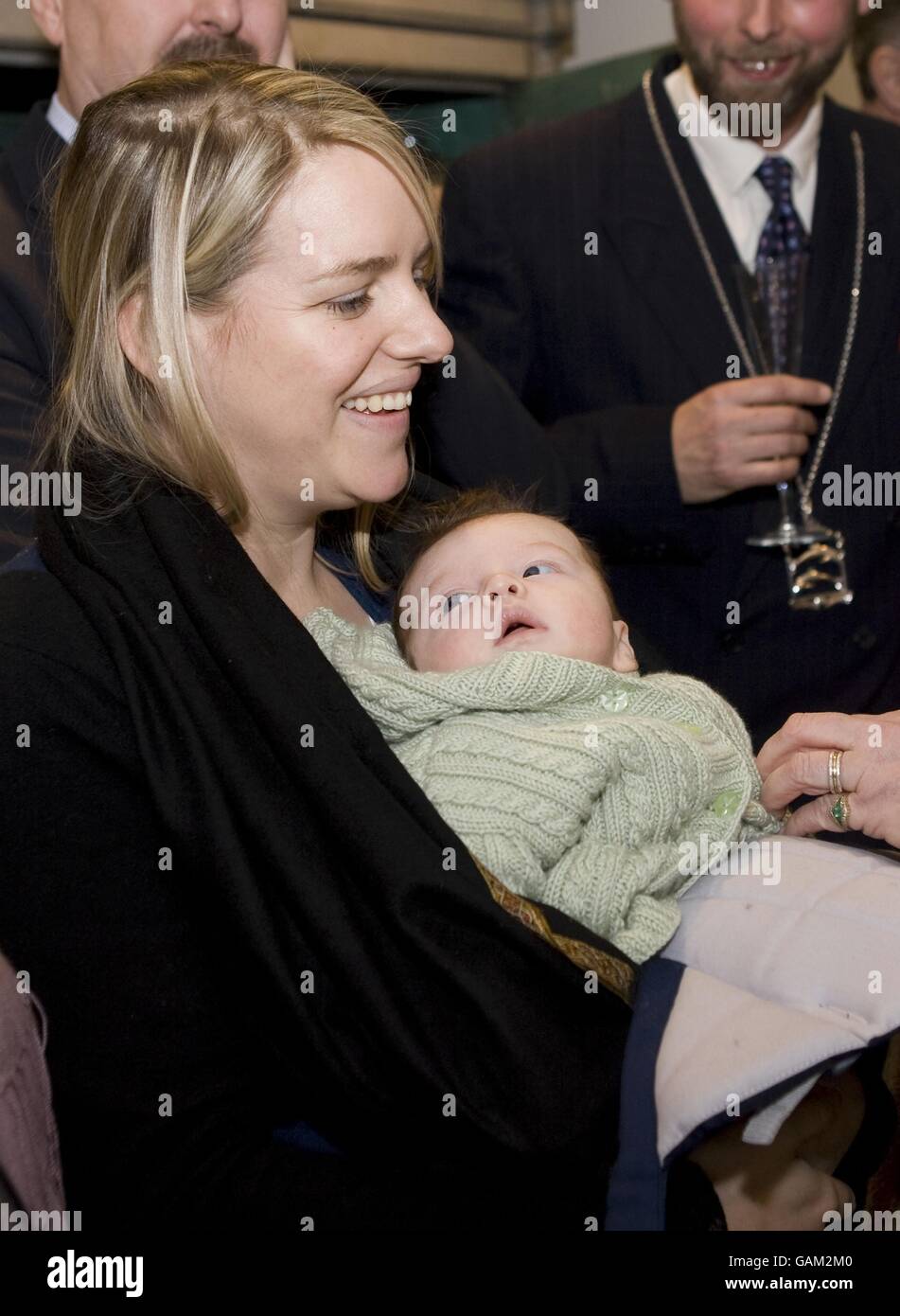 Laura Lopes and her baby daughter attend the opening of the new ...