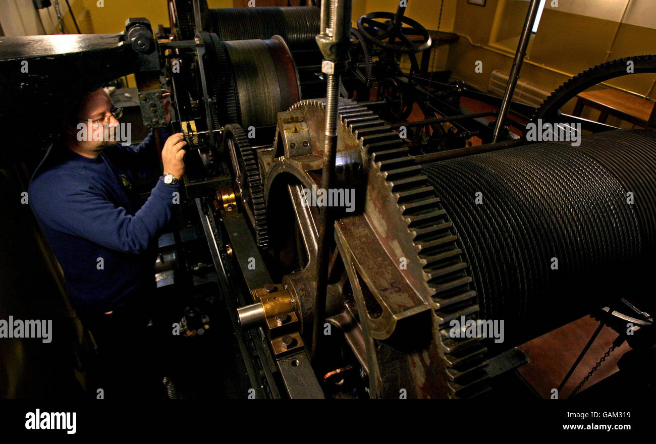 Maintenance worker Huw Smith checks the mechanism on the Great ...