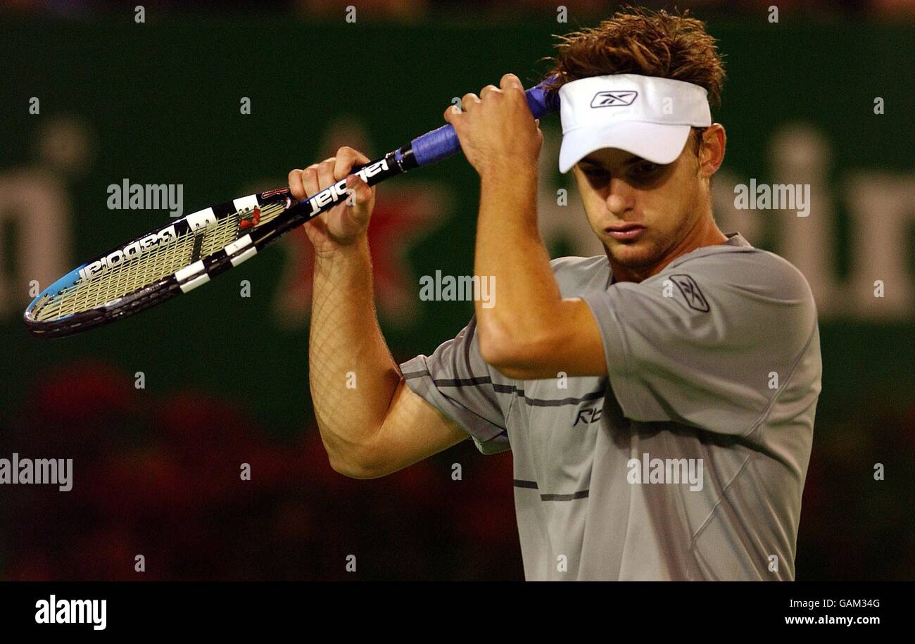 Andy Roddick (USA) pretends to shoot himself with his racquet during ...